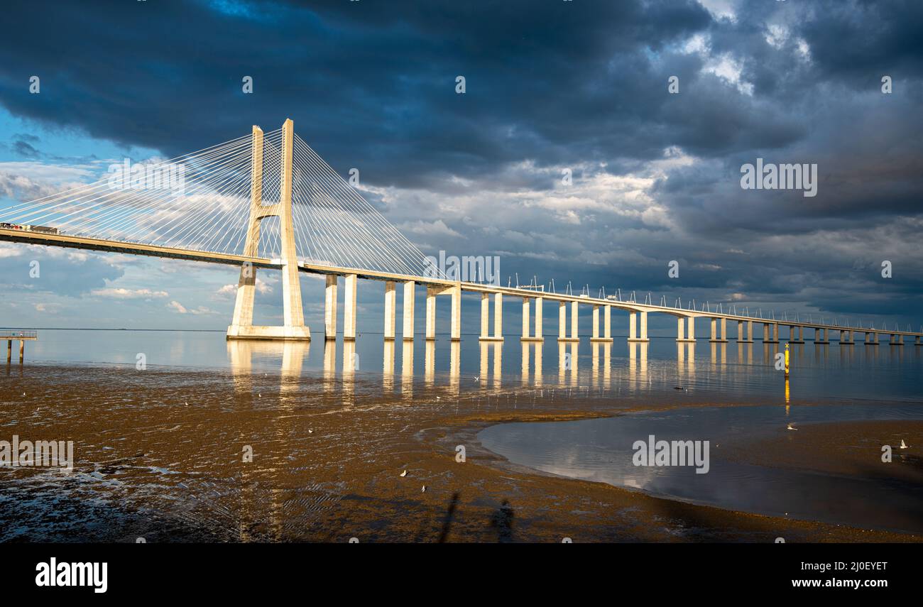 Vasco da Gama Bridge at sunset in Lisbon, Portugal Stock Photo - Alamy