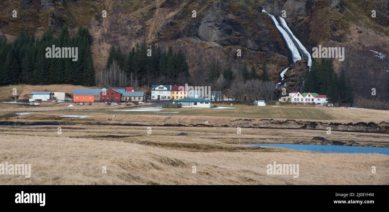 The Systrafoss waterfall above Kirkjubaejarklaustur town in Southeast ...