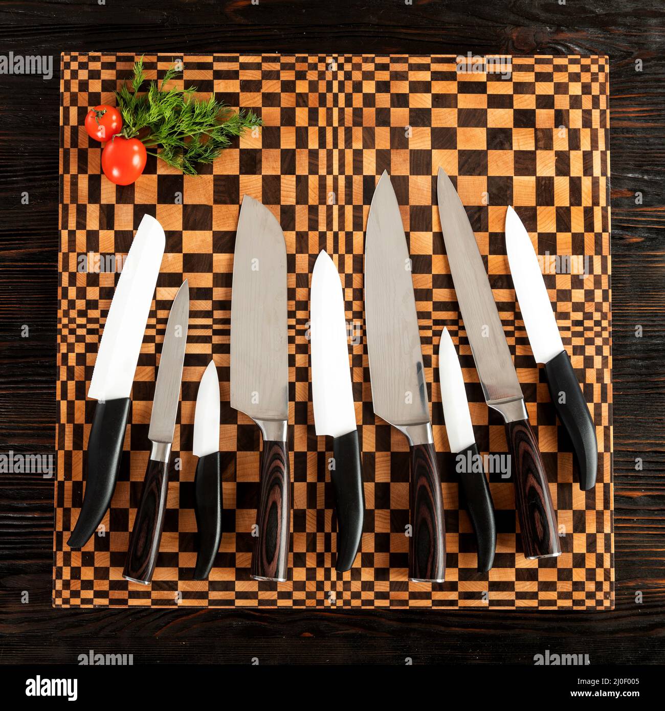 A set of high quality kitchen knives on a cutting board Stock Photo - Alamy