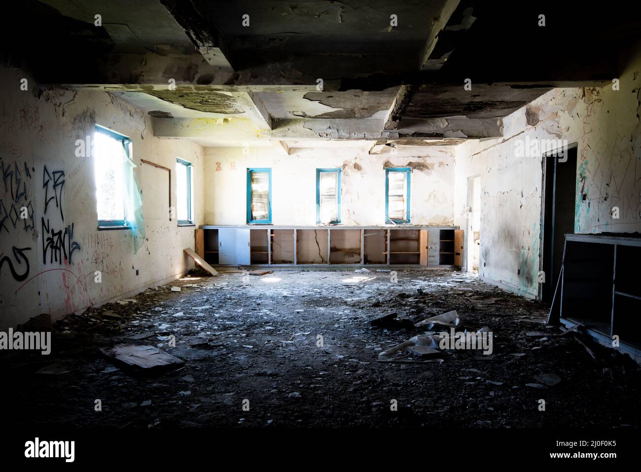 Interior of an old abandoned deserted and collapsing warehouse Stock ...
