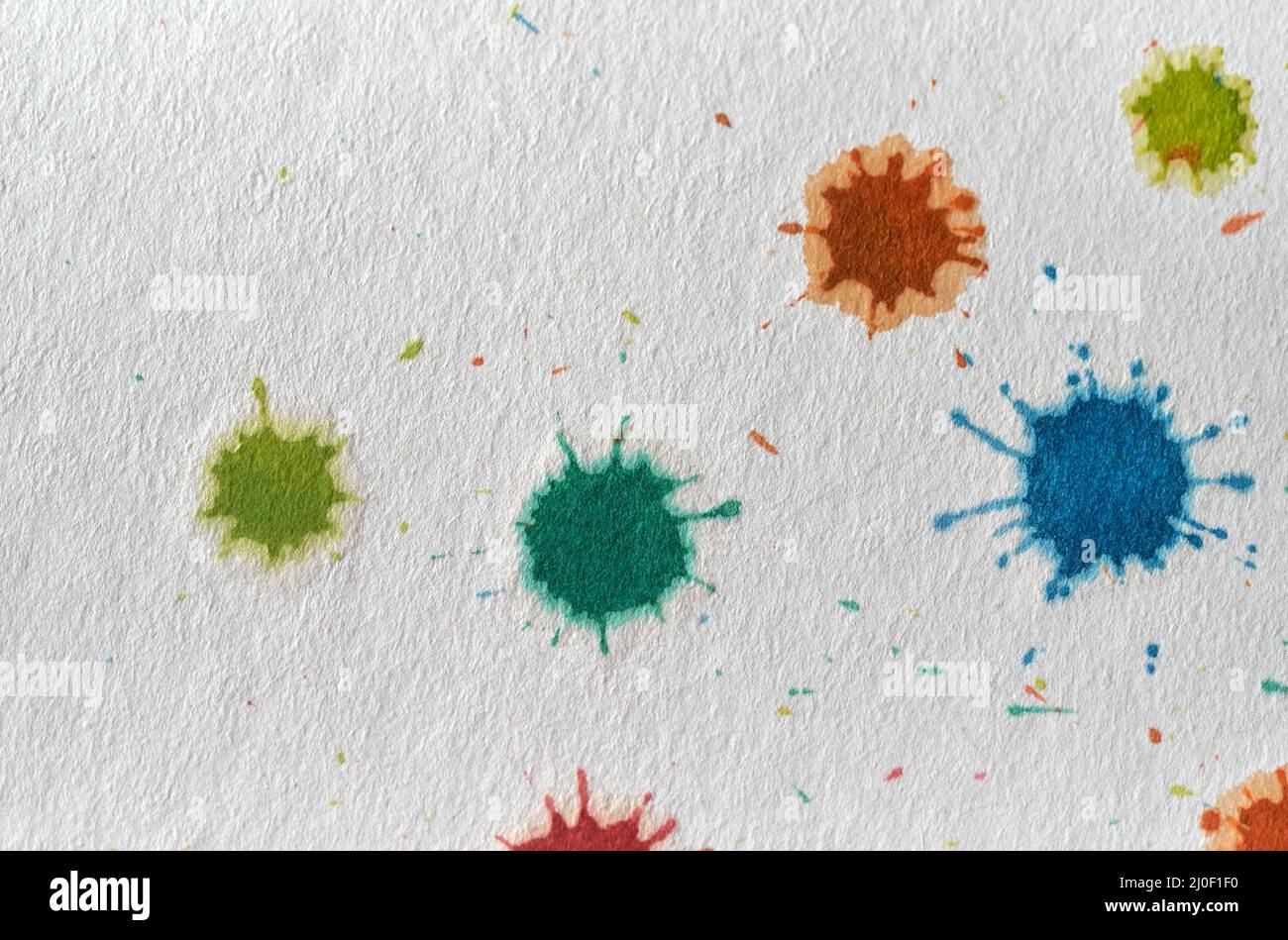 Colorful color stains on the rough textured paper Stock Photo - Alamy
