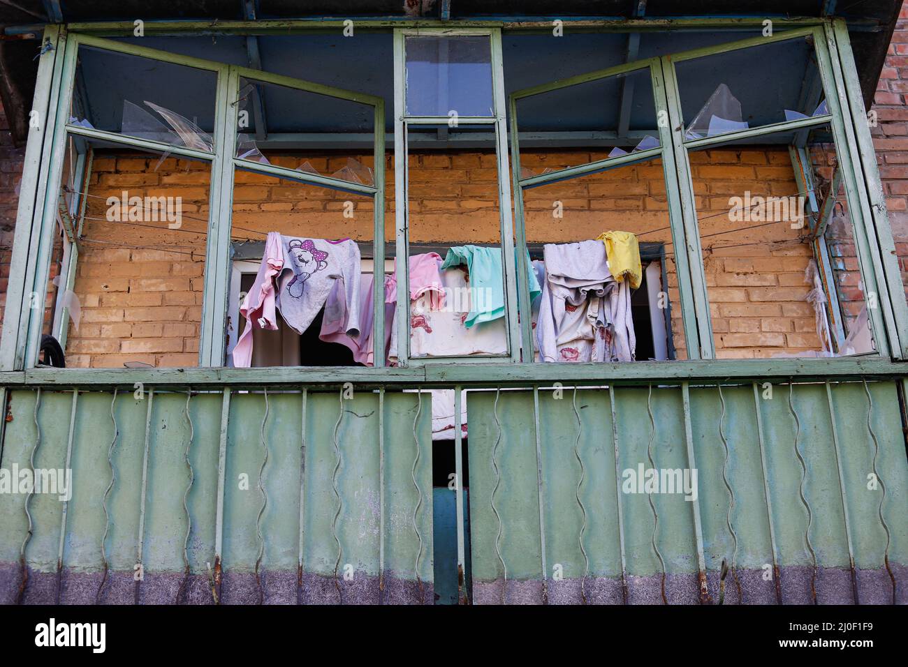 Broken windows on a residential building destroyed by a Russian ...