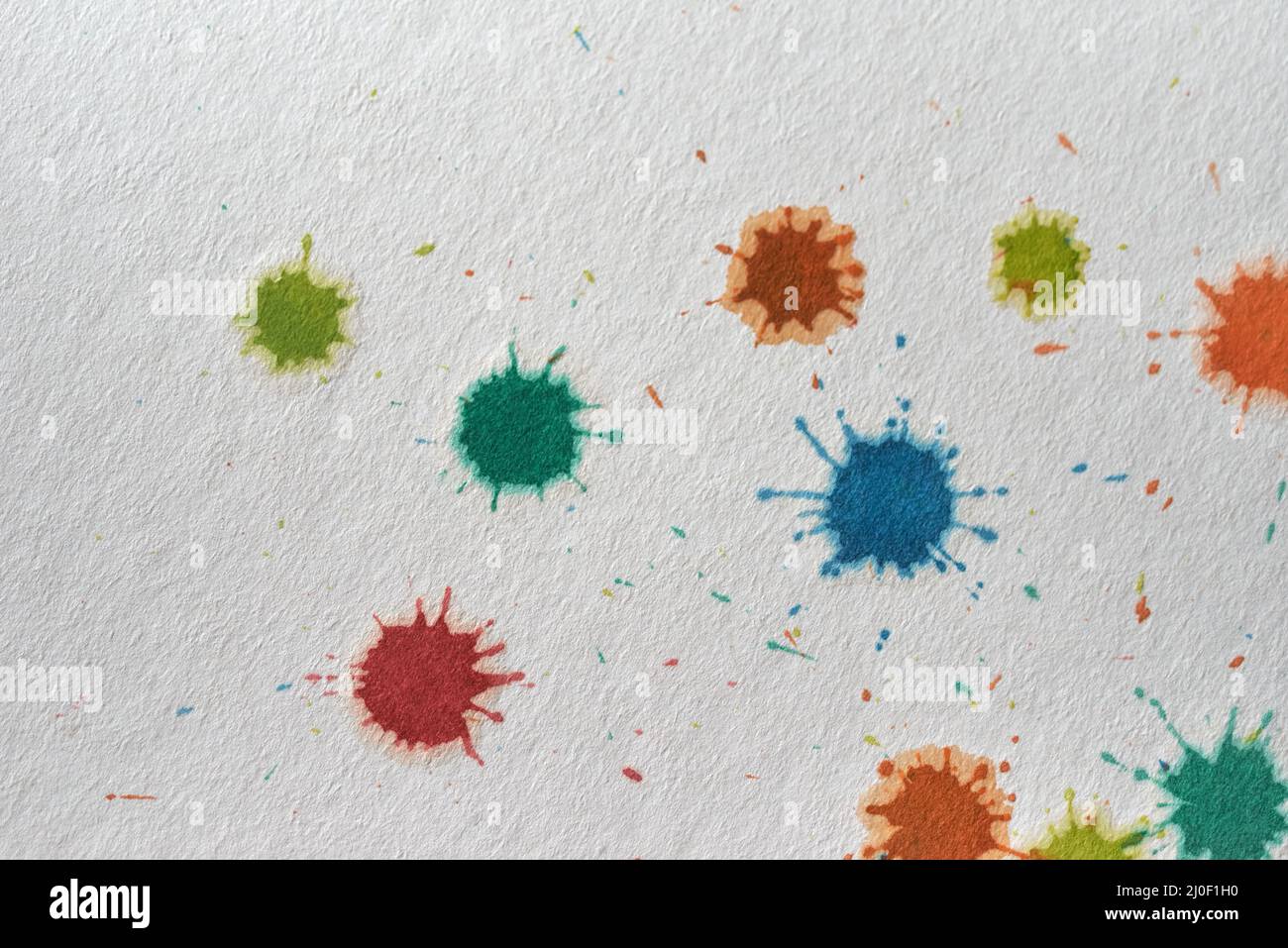 Colorful color stains on the rough textured paper Stock Photo - Alamy