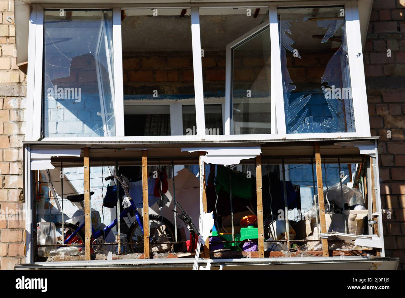 Broken windows on a residential building destroyed by a Russian ...