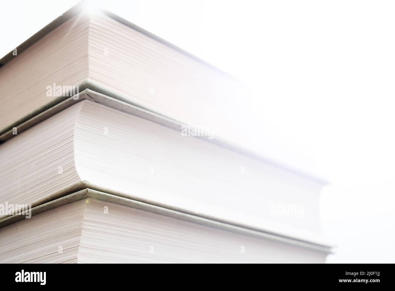 Thick paper books are a symbol of education and wisdom. A stack of ...