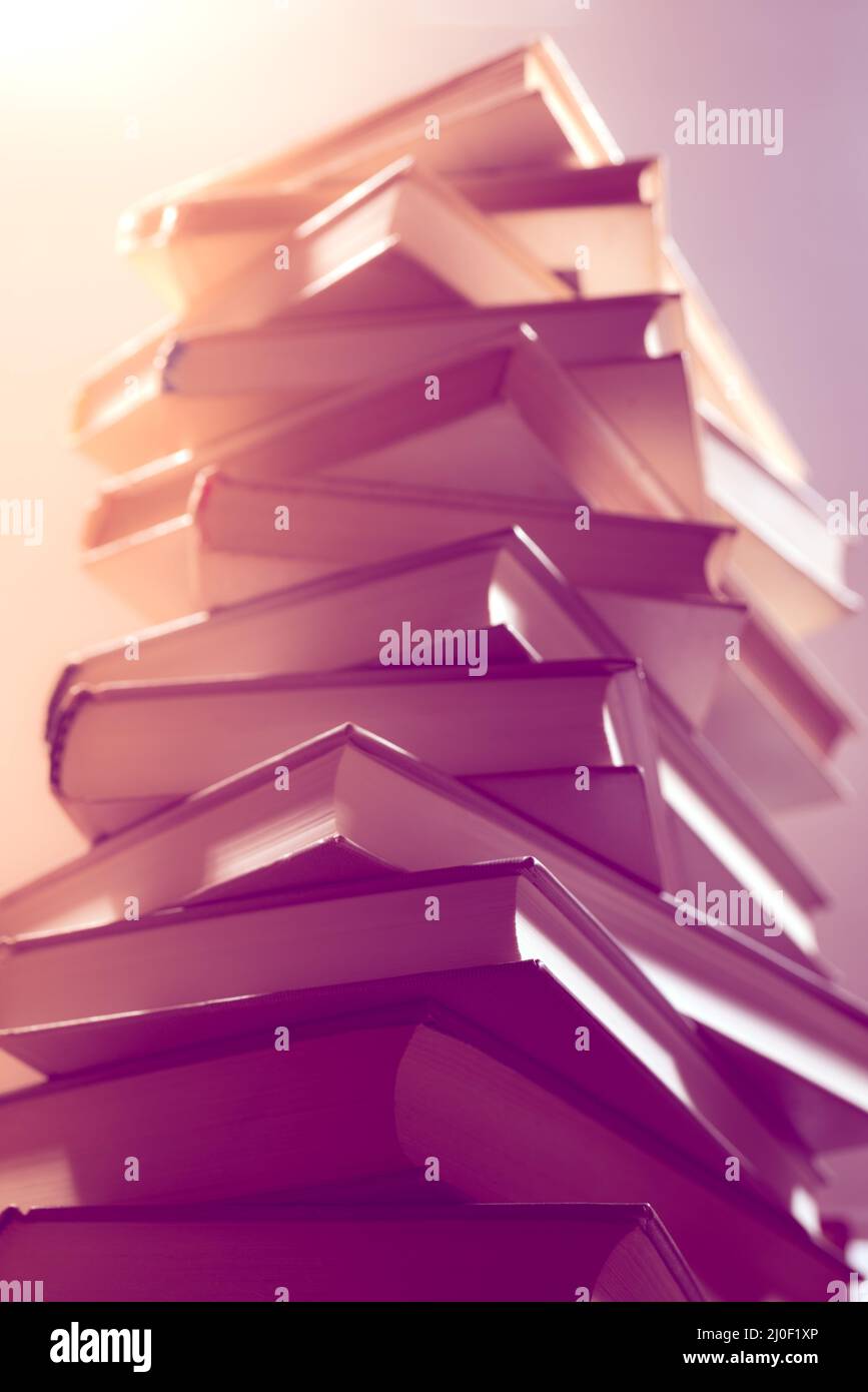 Stack of books in library. Scientific, educational, and fiction paper ...