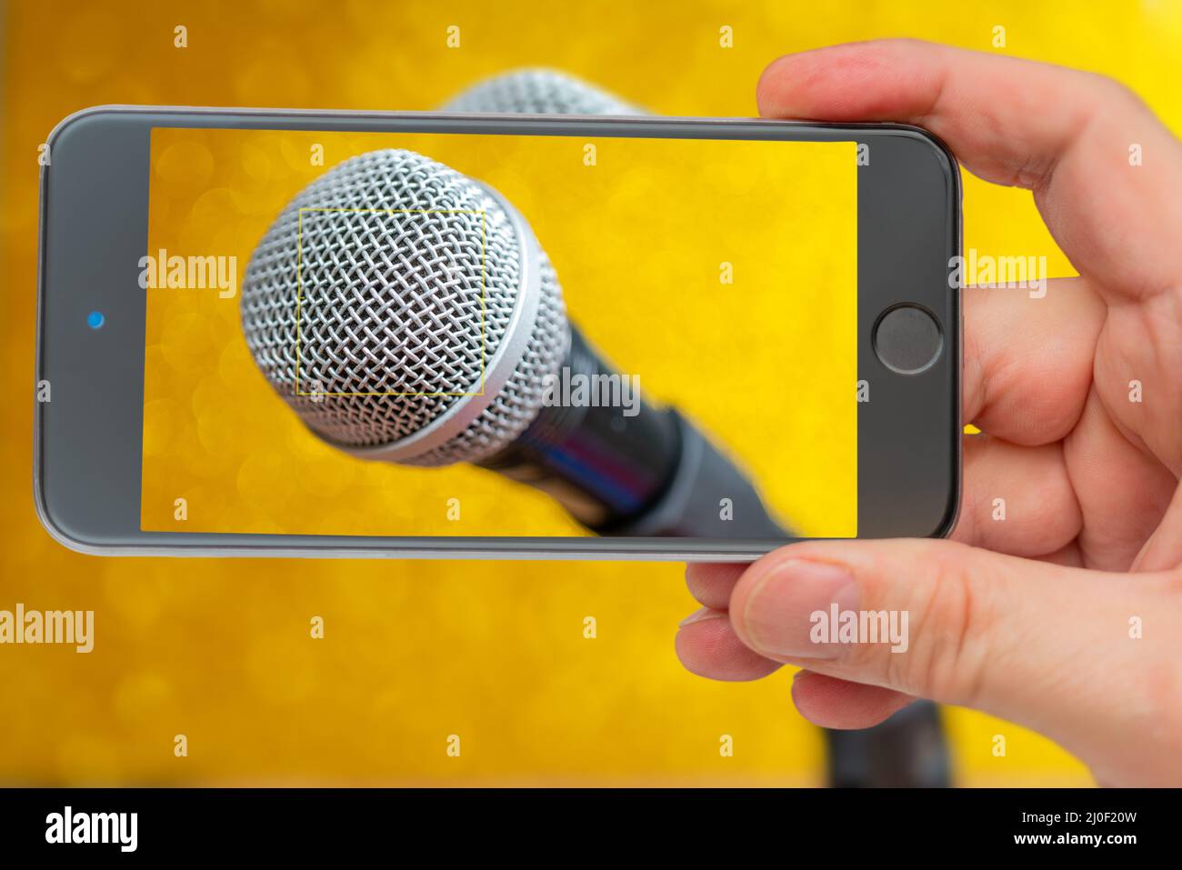 Microphone on smartphone screen. Professional dynamic microphone ...