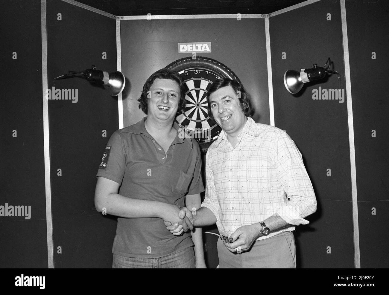 Professional British dart player Eric Bristow poses with winner John ...