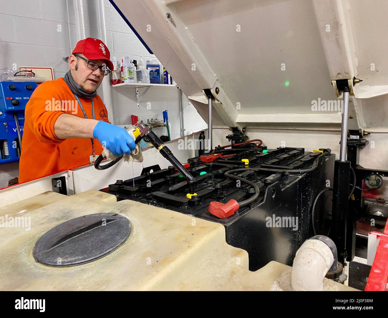 Evanston, Illinois, USA. 18th Mar, 2022. JOHN RUCCI adds water to the ...