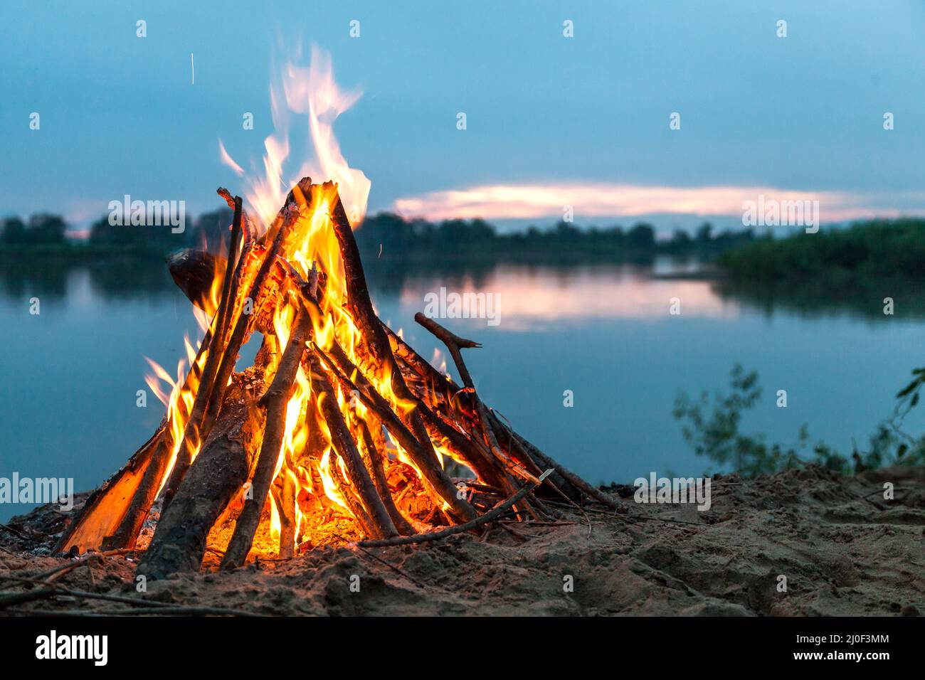 Beautiful bonfire by the river Stock Photo - Alamy