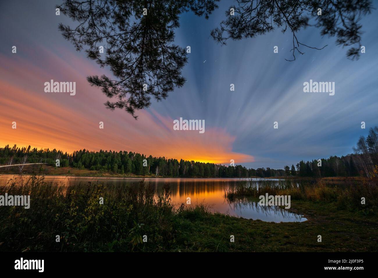 Beautiful sunset over the river and forest Stock Photo - Alamy