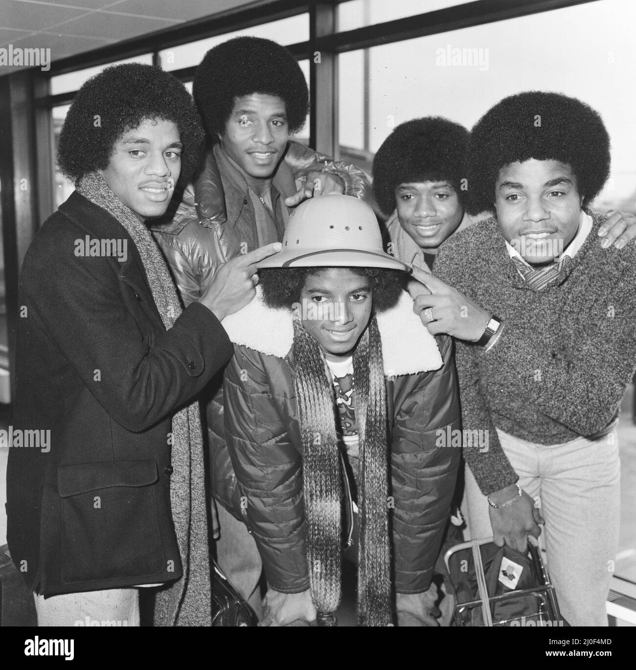 Members of The Jackson Five pop group make their way through the ...