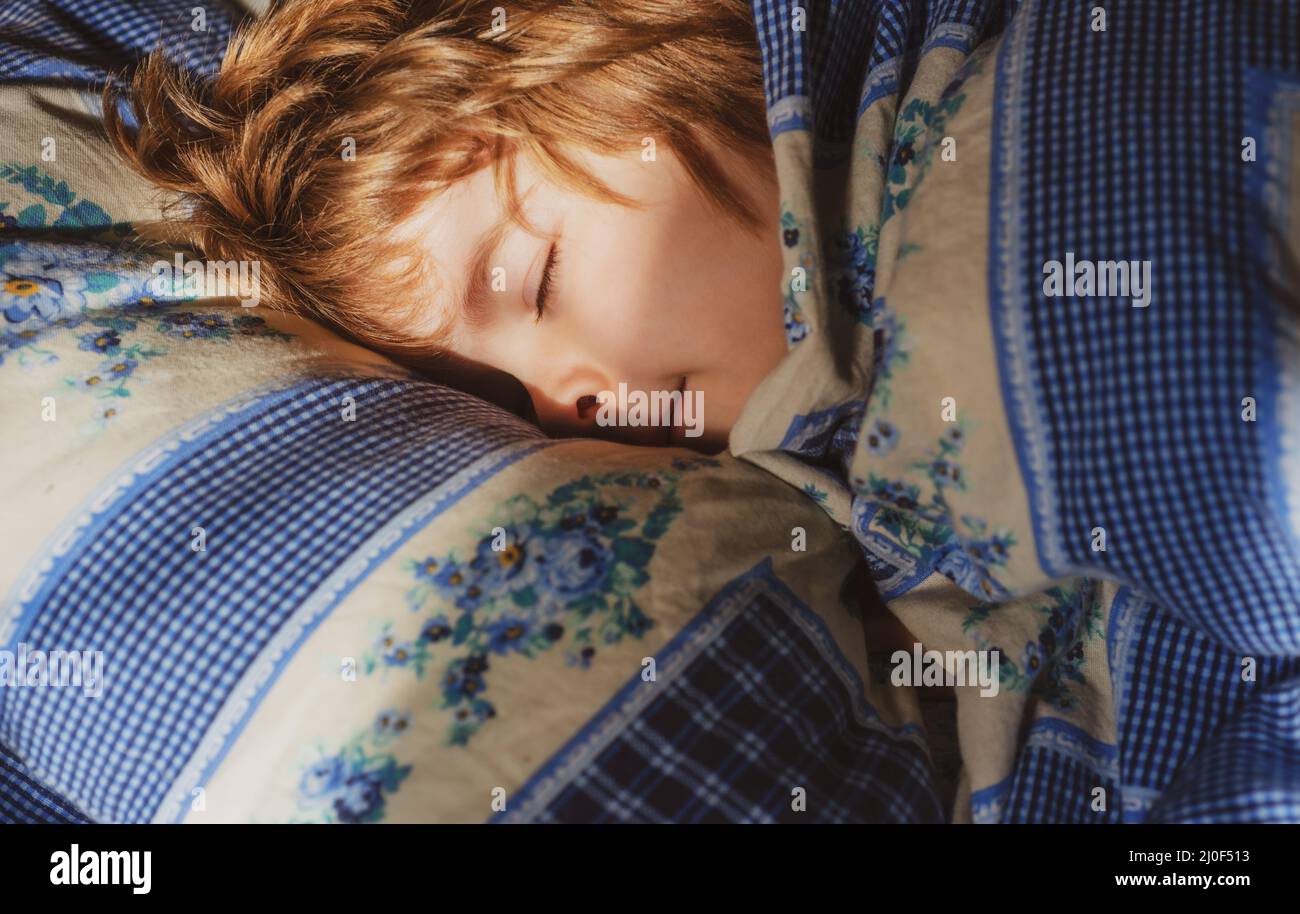 Child sleeping in the bed. Adorable small kids rest asleep enjoy good ...