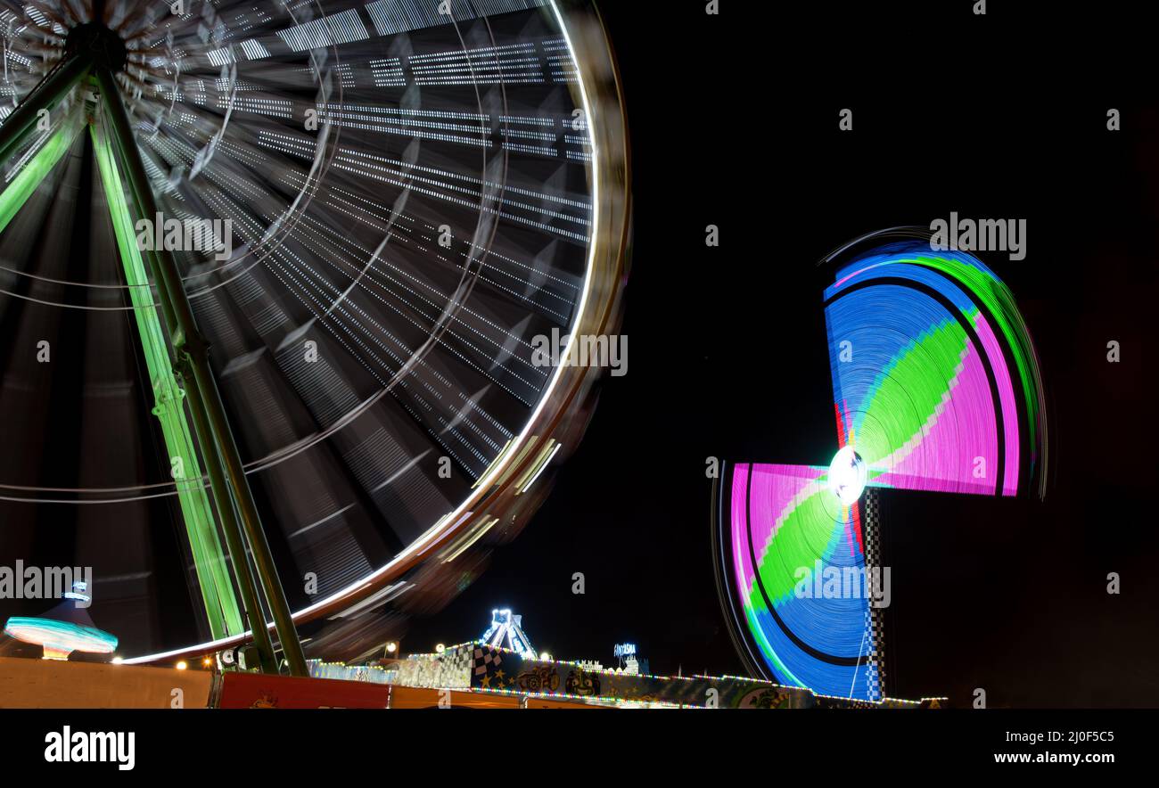 Ferris wheel rotating on an amusement park Stock Photo - Alamy