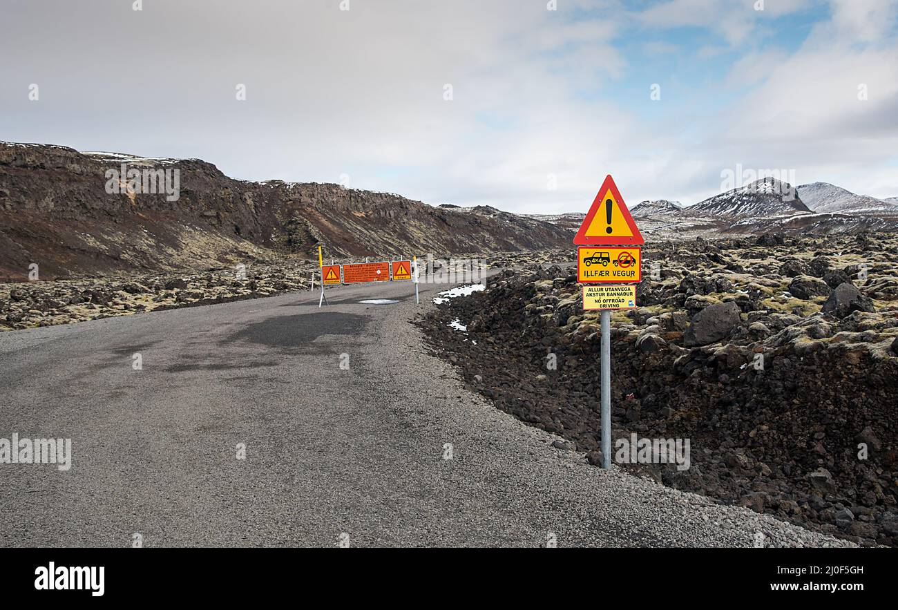 Dangerous closed road with warning signs in Iceland Stock Photo - Alamy