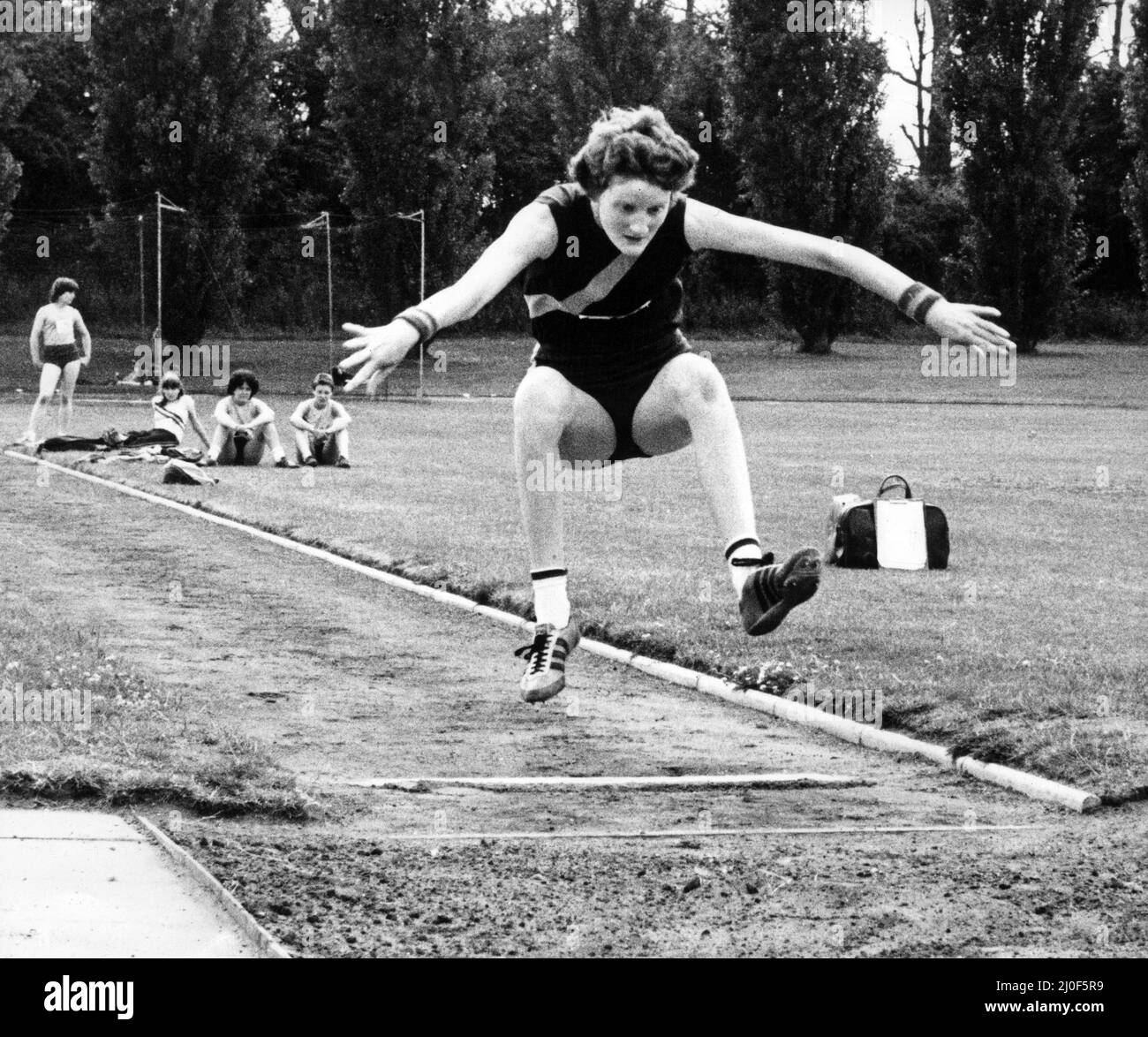 Melanie Moore throws her arms wide and bids for height and length in ...