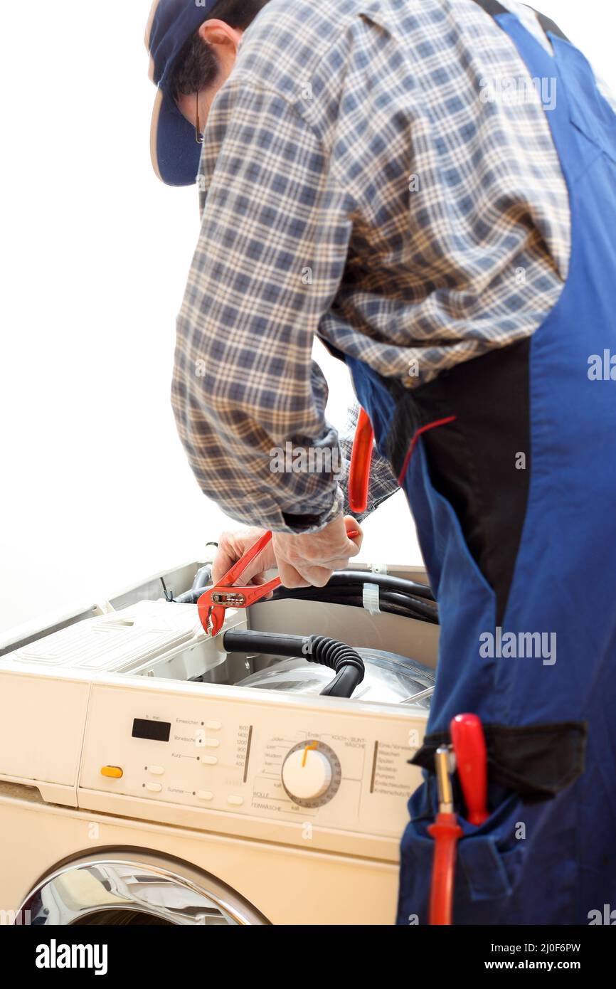 Repairing a machine Stock Photo - Alamy