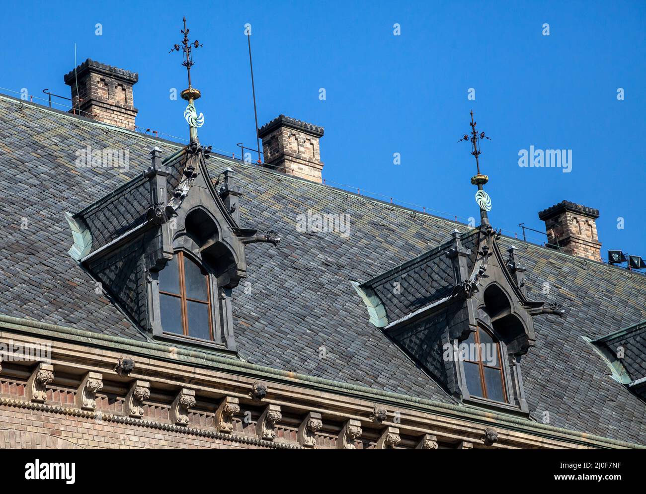 Dormer windows on the roof of gothic building Stock Photo - Alamy