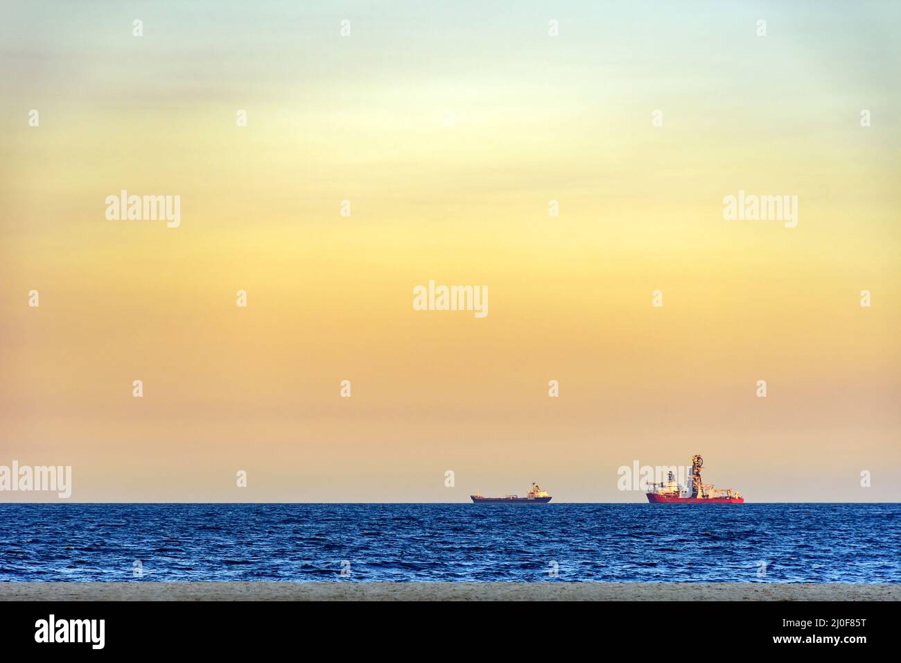 Container ship during sunset hi-res stock photography and images - Alamy