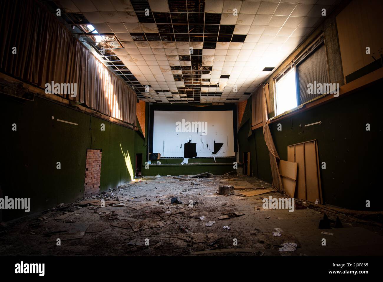 Abandoned and damaged interior of a movie theatre with stage. Nicosia ...