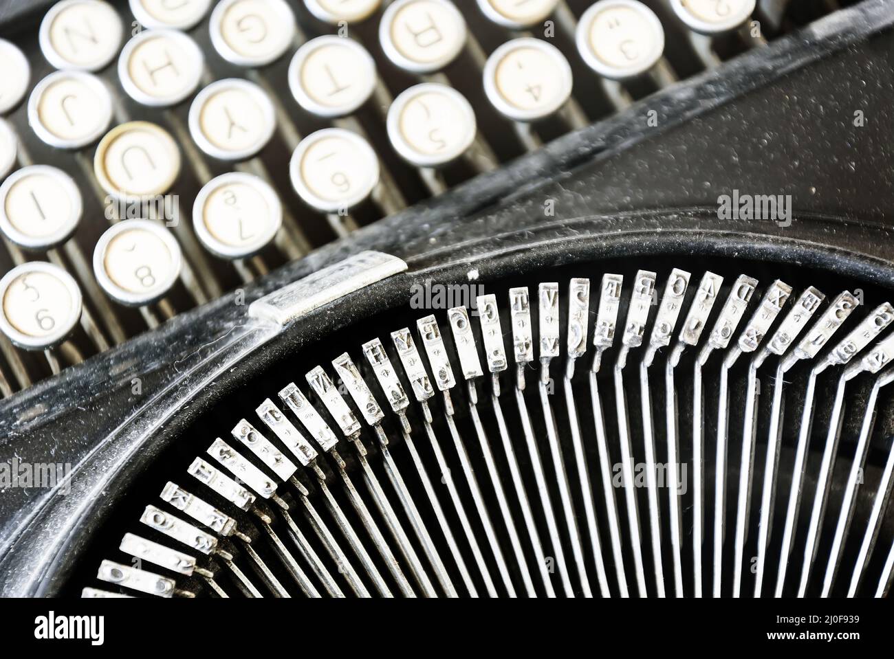 The iron hammers of an old typewriter Stock Photo - Alamy