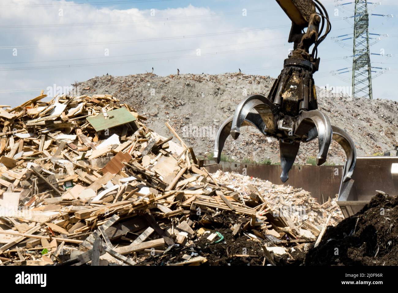 Waste wood storage in a landfill Stock Photo - Alamy