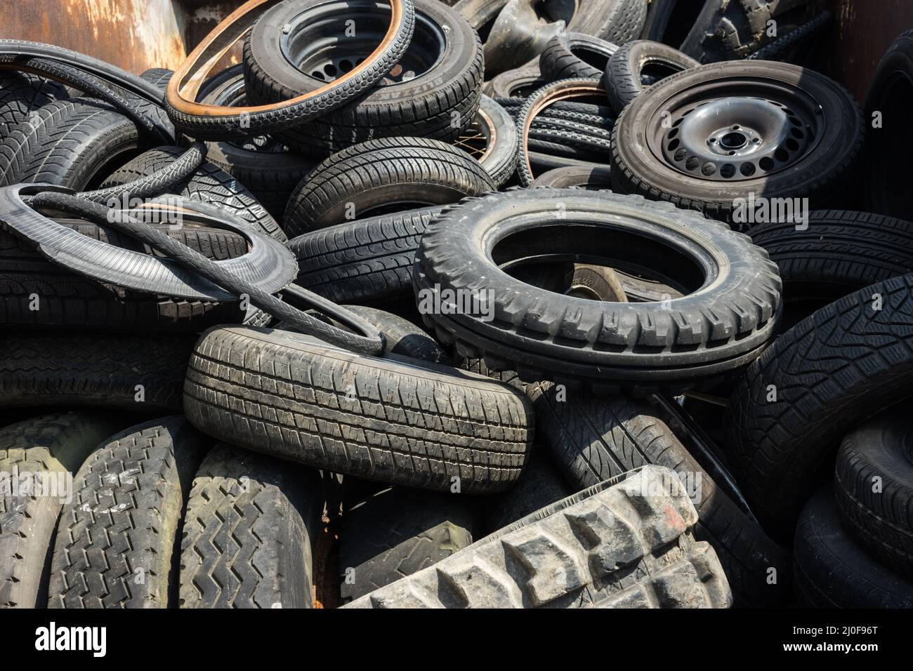 Used tyres in a recycling yard Stock Photo - Alamy