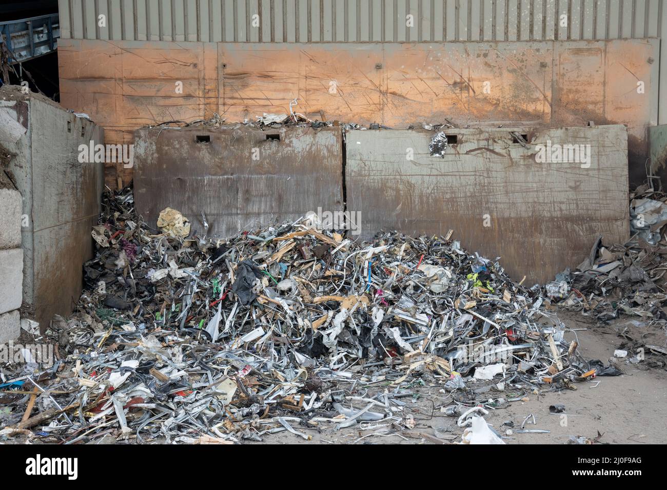 Discarded metal from reclaimed wood processing Stock Photo - Alamy