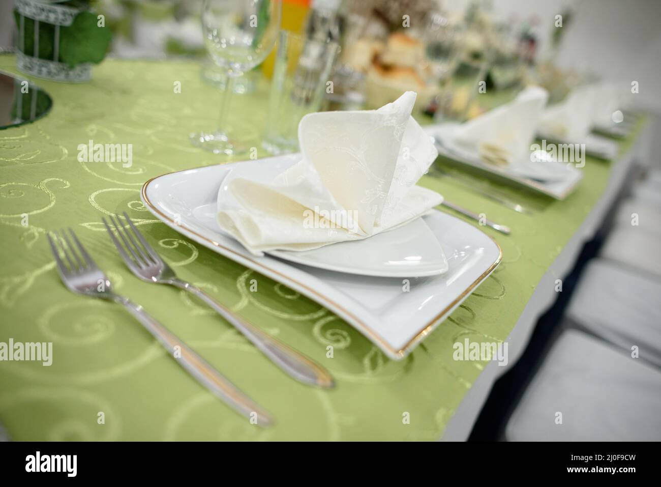Selective focus shot of an elegant table arrangement in a wedding ...