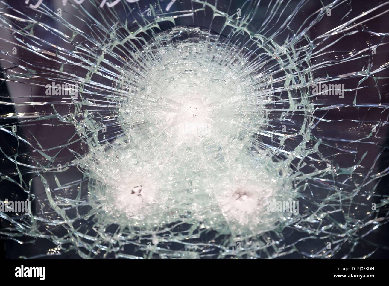 Cracked bulletproof glass Stock Photo - Alamy