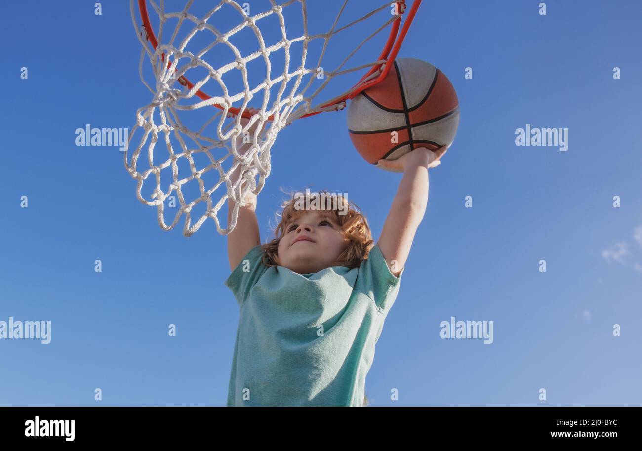 Basketball Slam Dunks of sporty kids basketball player. Close up image ...