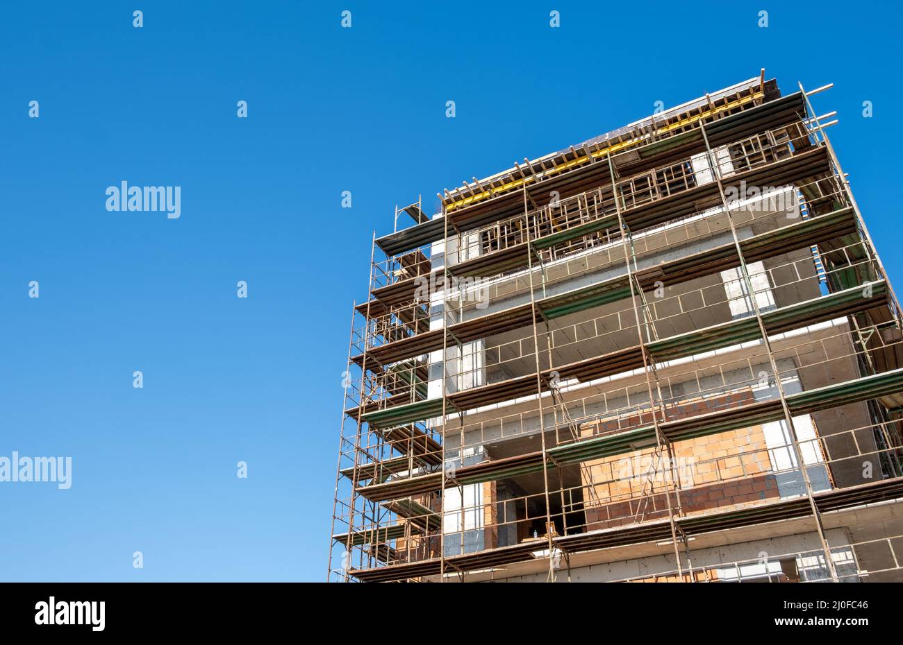 Residential building construction site against a blue clear sky Stock ...