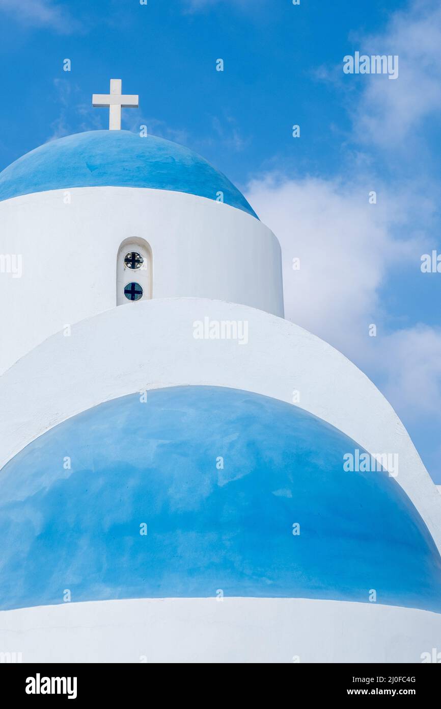 Traditional christian church with belfry and dome against blue cloudy ...