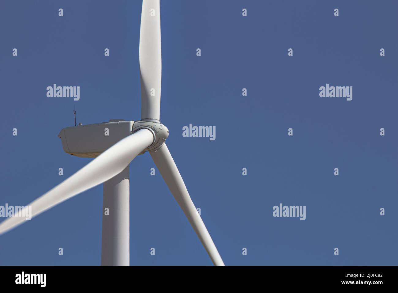 Close up, side view of a wind tower turbine electricity gererator ...