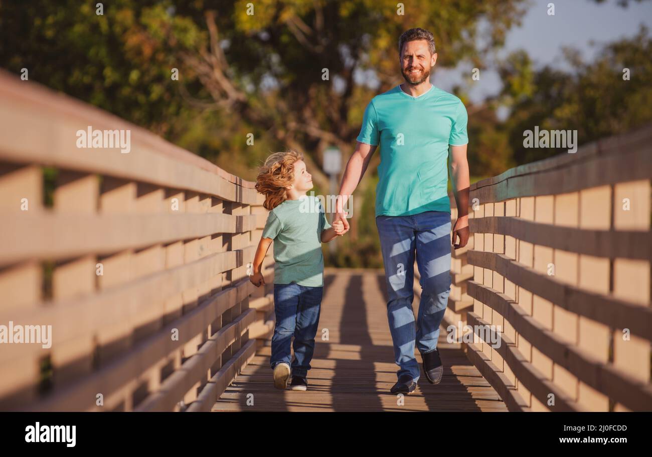 Friendly family. Happy father and son. Dad and child playing outdoors ...