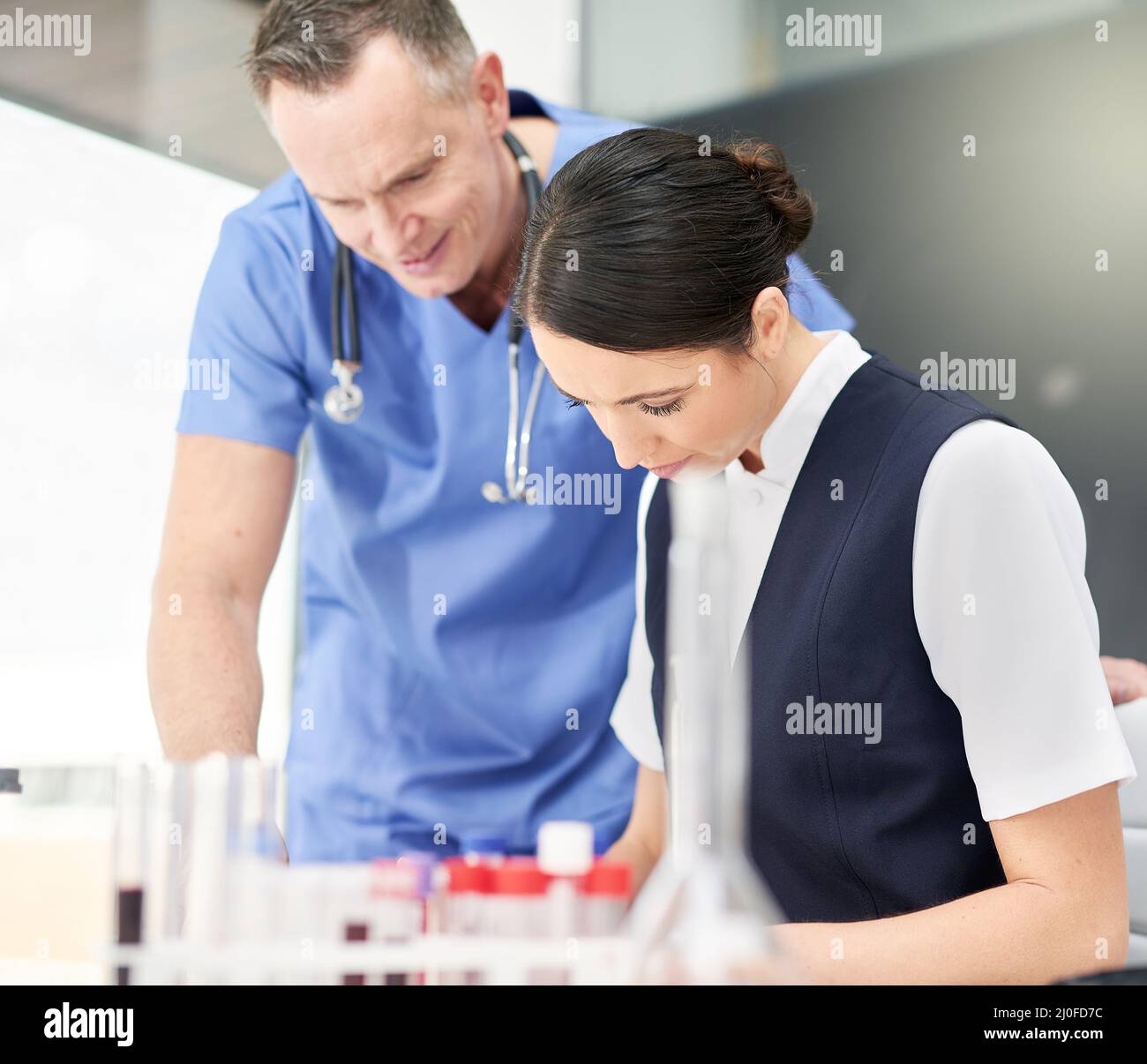 Two diagnoses are better than one. Shot of two doctors examining test ...