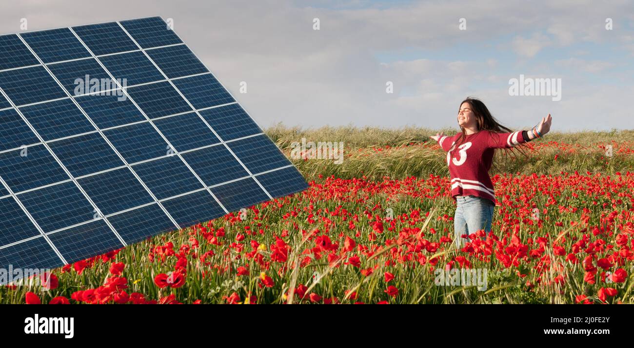 Solar energy panel and teenage girl on a field with red poppies Stock ...