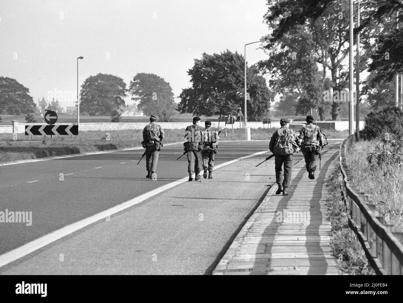 British paramilitary soldiers patrol the at the scene of one of the two ...