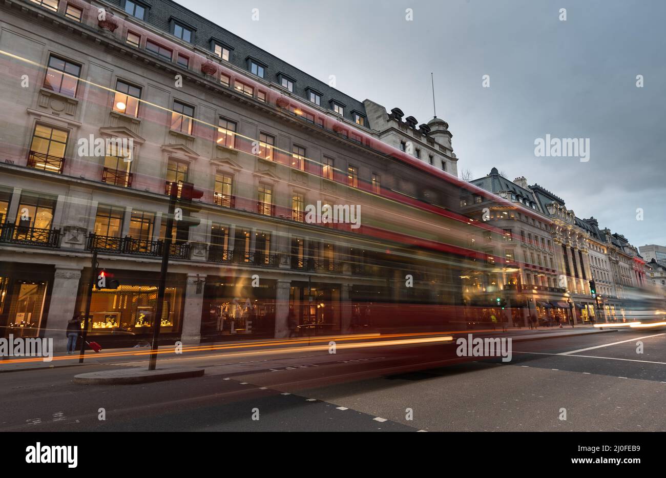 Light trails of a fast moving red bus in the city of London Stock Photo ...