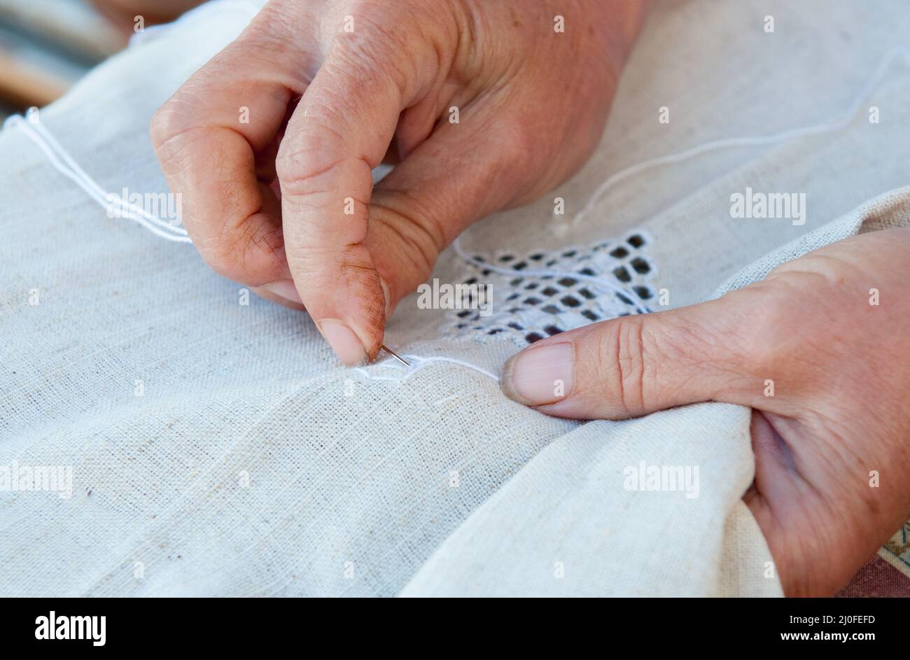 Hands woman sewing cloth hi-res stock photography and images - Alamy