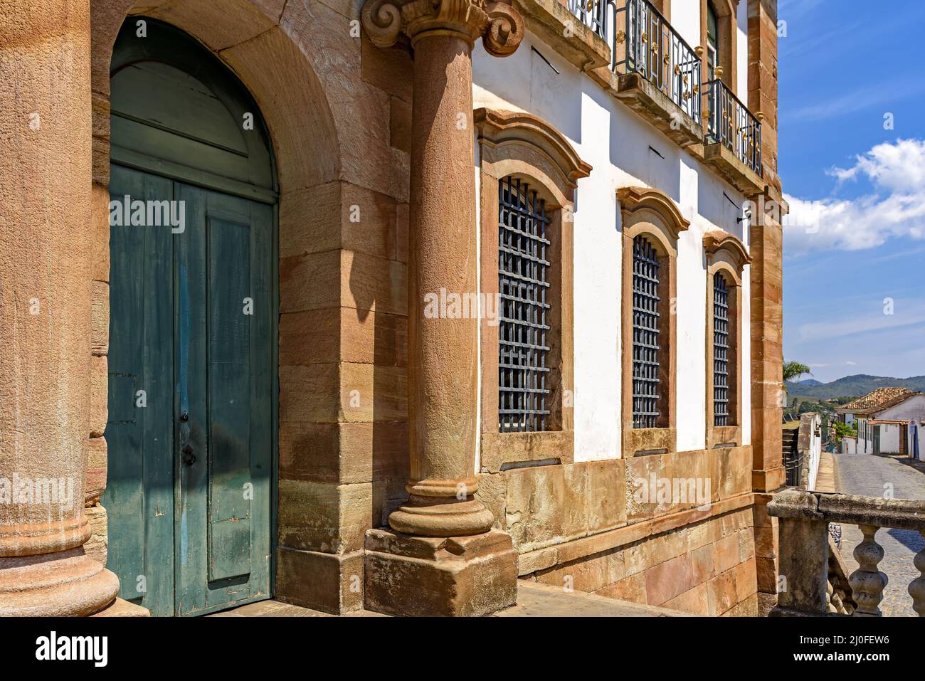 Facade of a historic building and its columns, doors and windows in ...