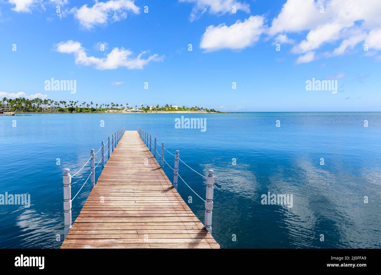 Wooden bridge juts out into of the sea Stock Photo - Alamy