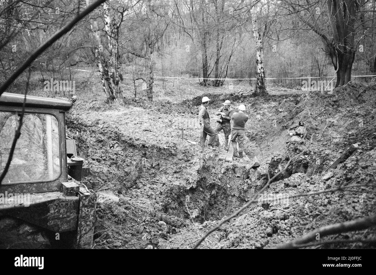 Bomb disposal men from the Royal Engineers dig out an unexploded German ...