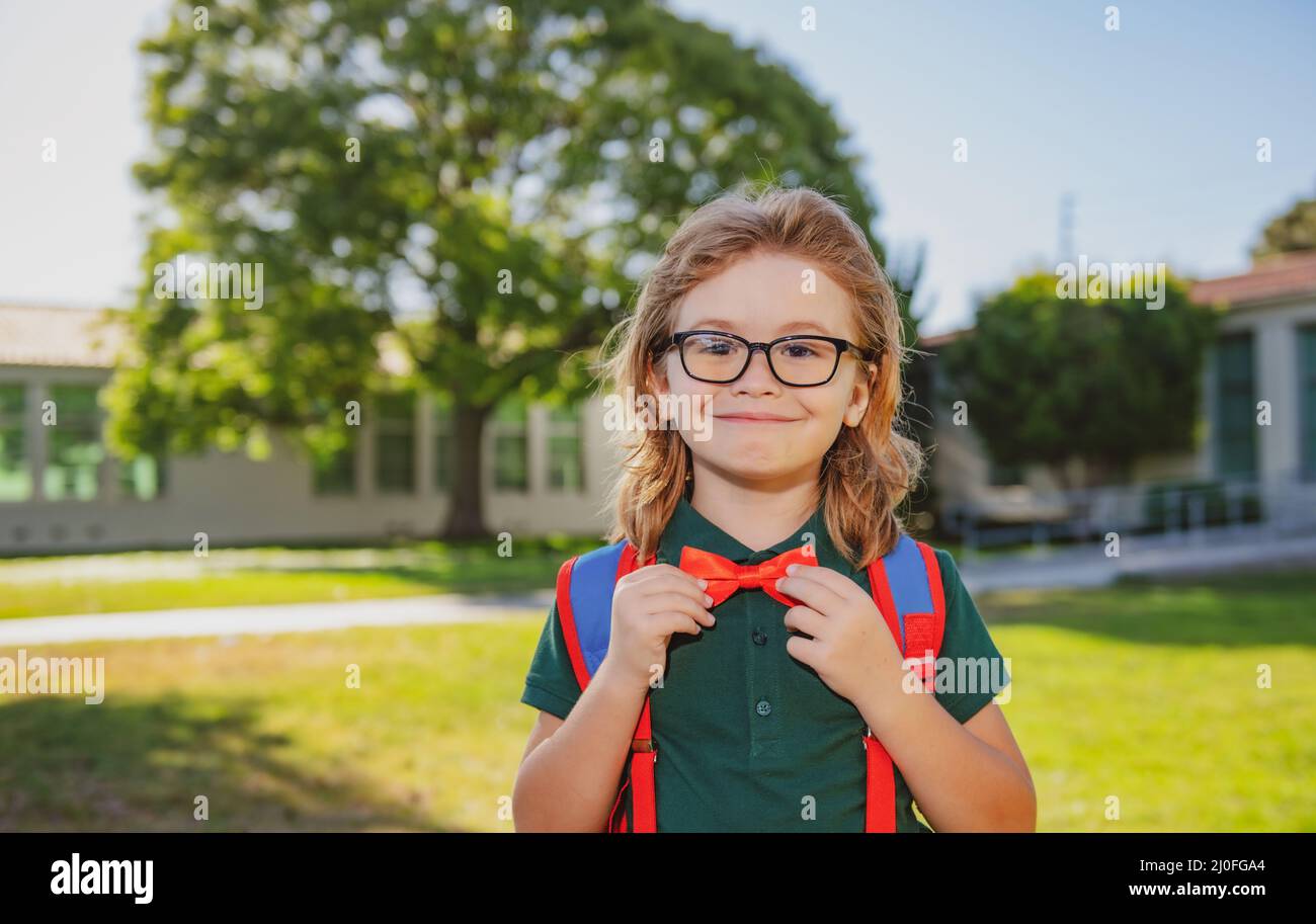 School child concept. Cute pupil, kid in school uniform with backpack ...