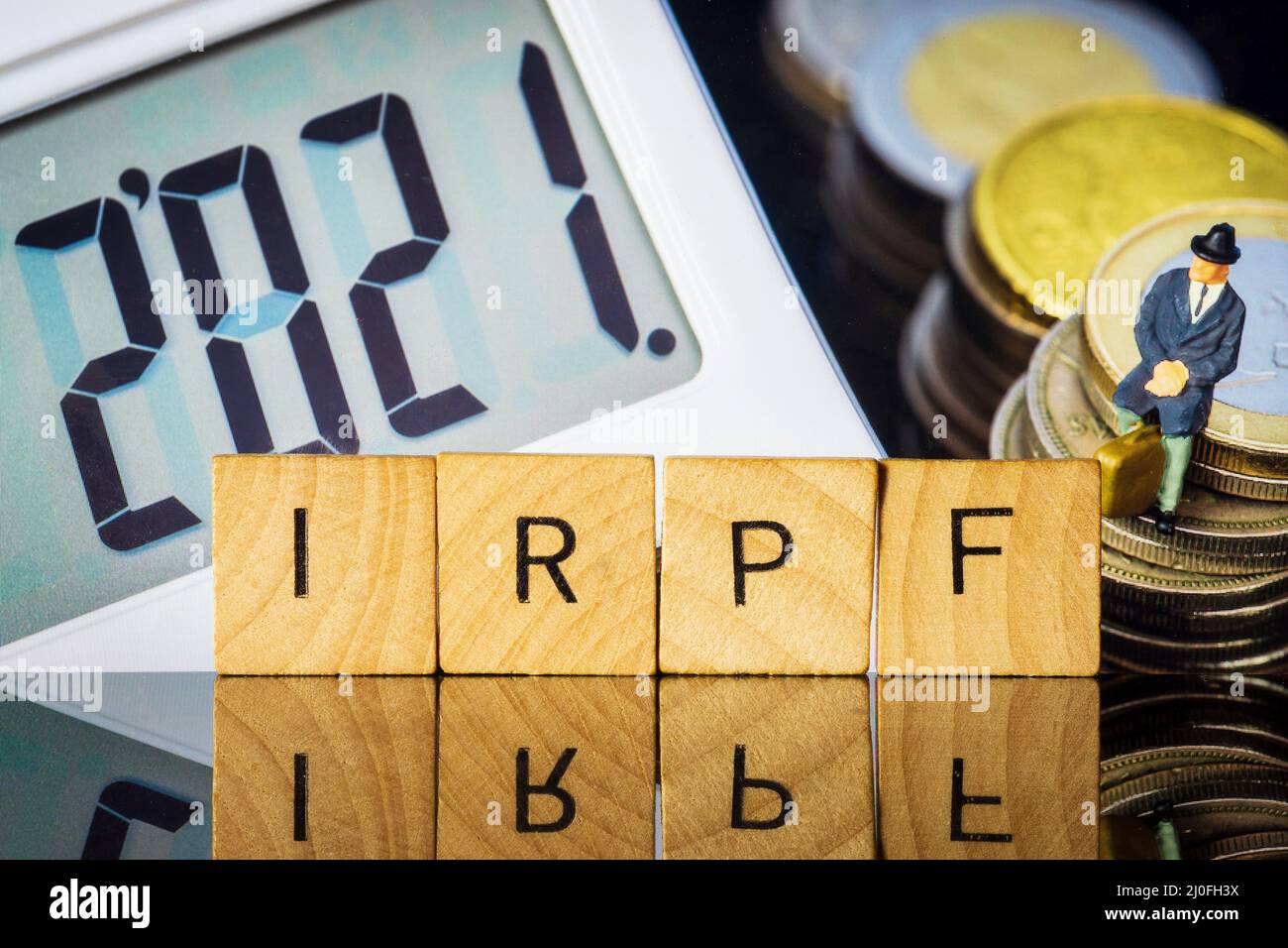 Income Tax Campaign 2021. Taxman sitting on coin stack. IRPF sign Stock ...