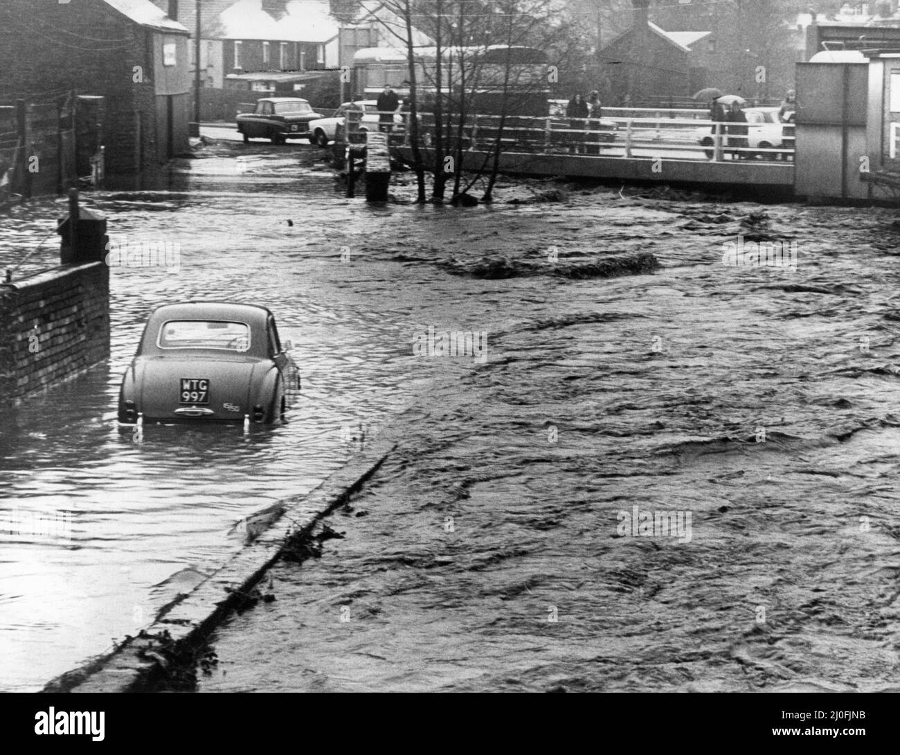 Welsh Floods 1979, Our picture shows ... the riverbank at Porth cracked ...