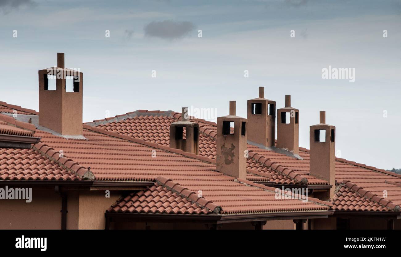 House rooftops with chimneys Stock Photo - Alamy