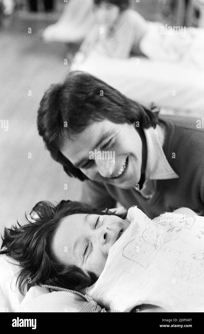 British Motorcycle road racer Barry Sheene with young fan Tony Vickers ...
