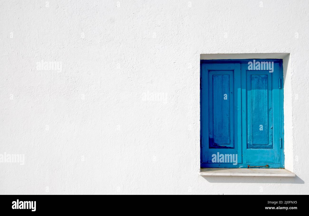 Blue window on a white wall Stock Photo - Alamy