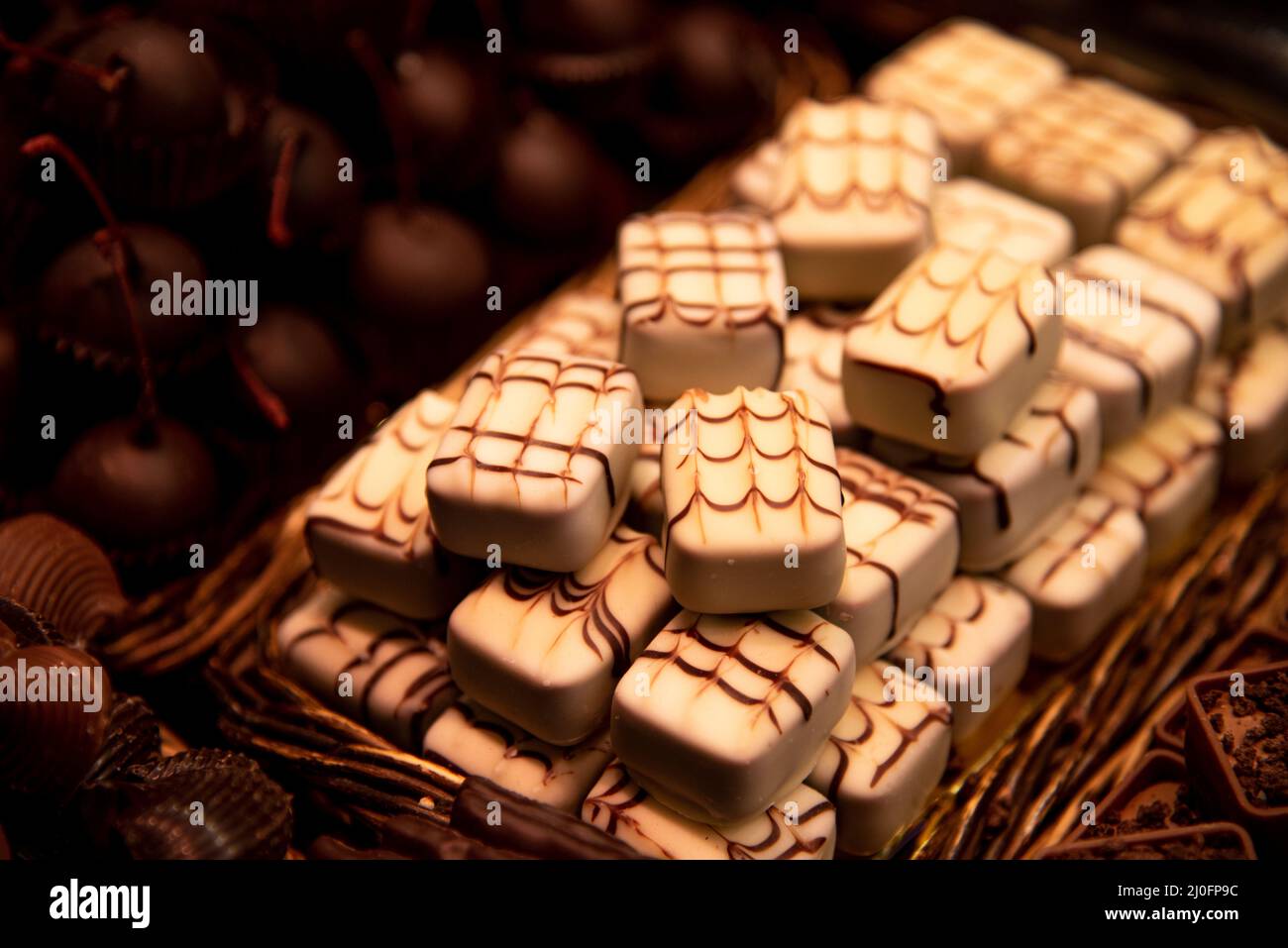 Delicious and tasty sweet bar of white chocolates at a confectionery ...